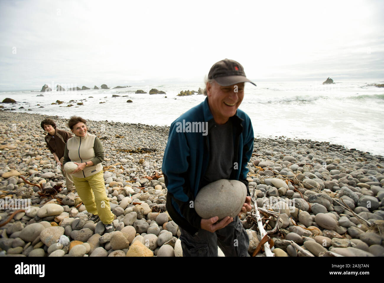 Three people playing on a beach hi-res stock photography and images - Alamy
