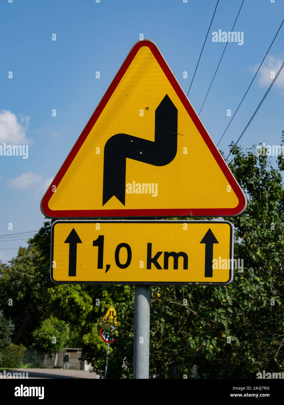 Dangerous turn right then left. Road signs on a country road. Warning ...