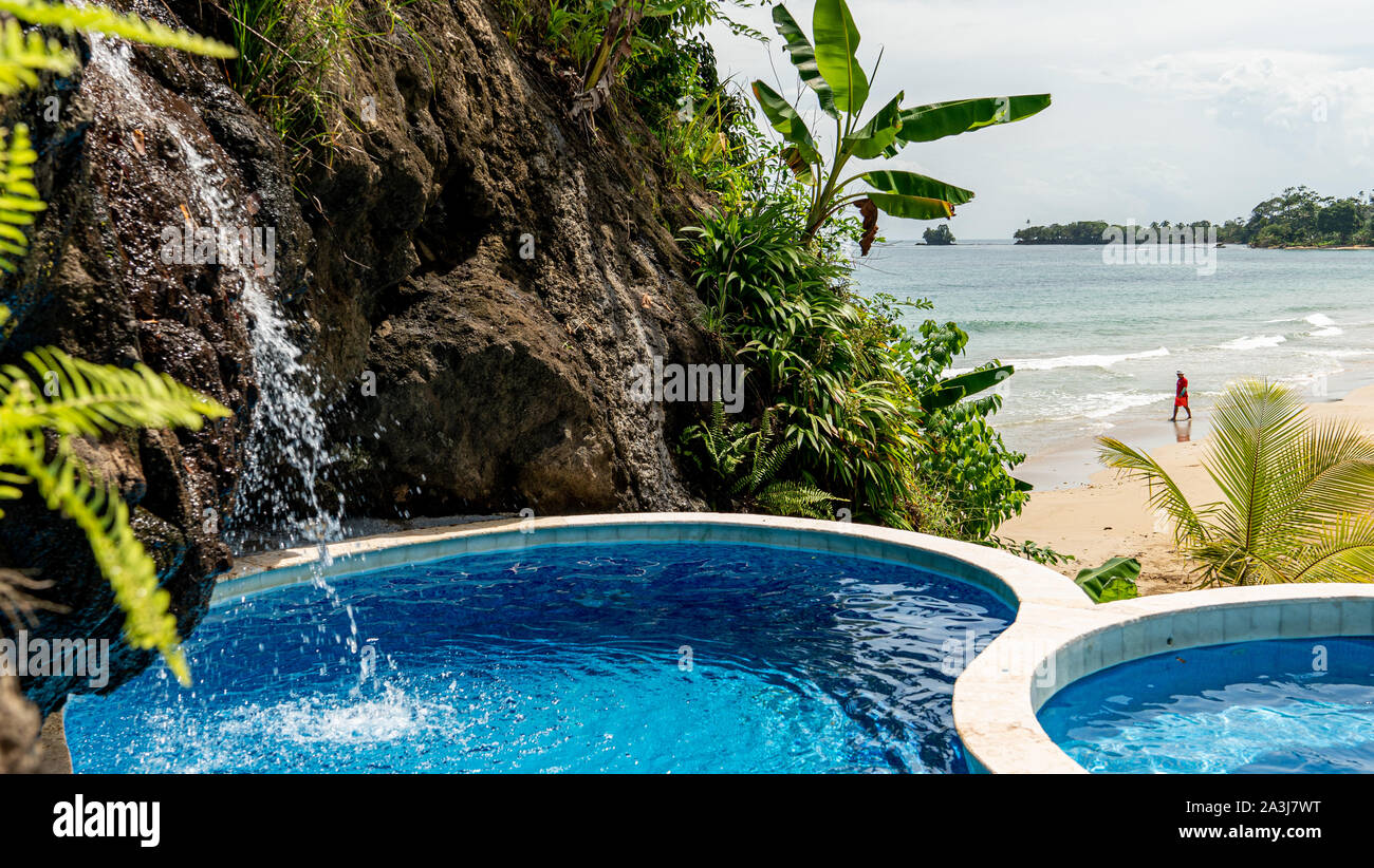 Woman overlooking pool hi-res stock photography and images - Alamy