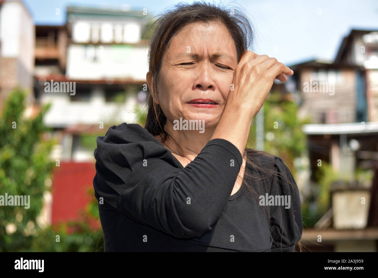A Filipina Female Senior Crying Stock Photo - Alamy