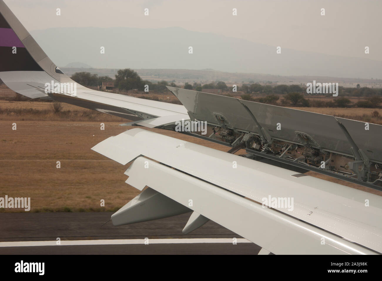 Airplane wing in function showing the internal mechanisms seen through ...