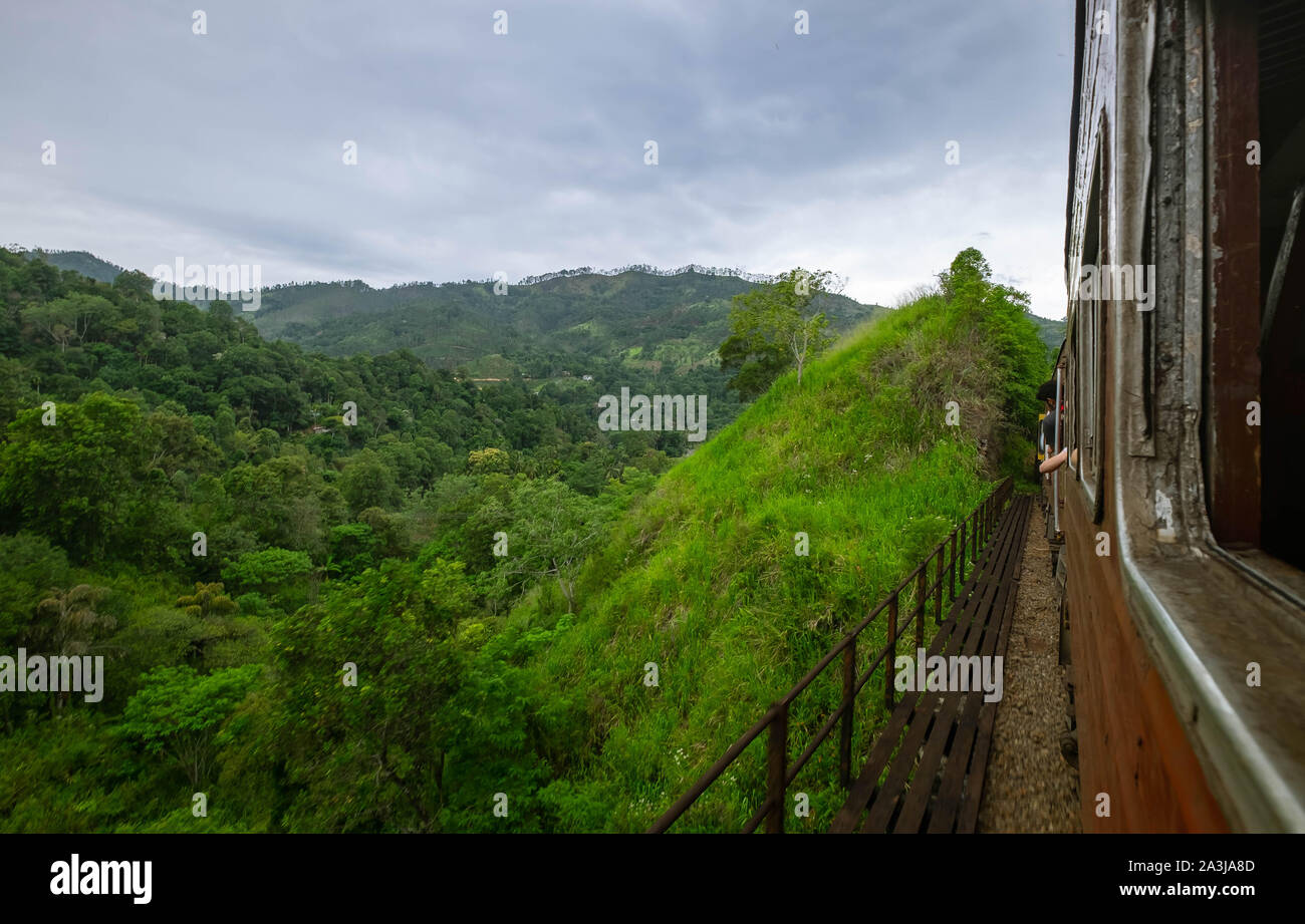 ELLA/ DEMODARA, SRI-LANKA: AUGUST 08/ 2019: The train acrossing the ...