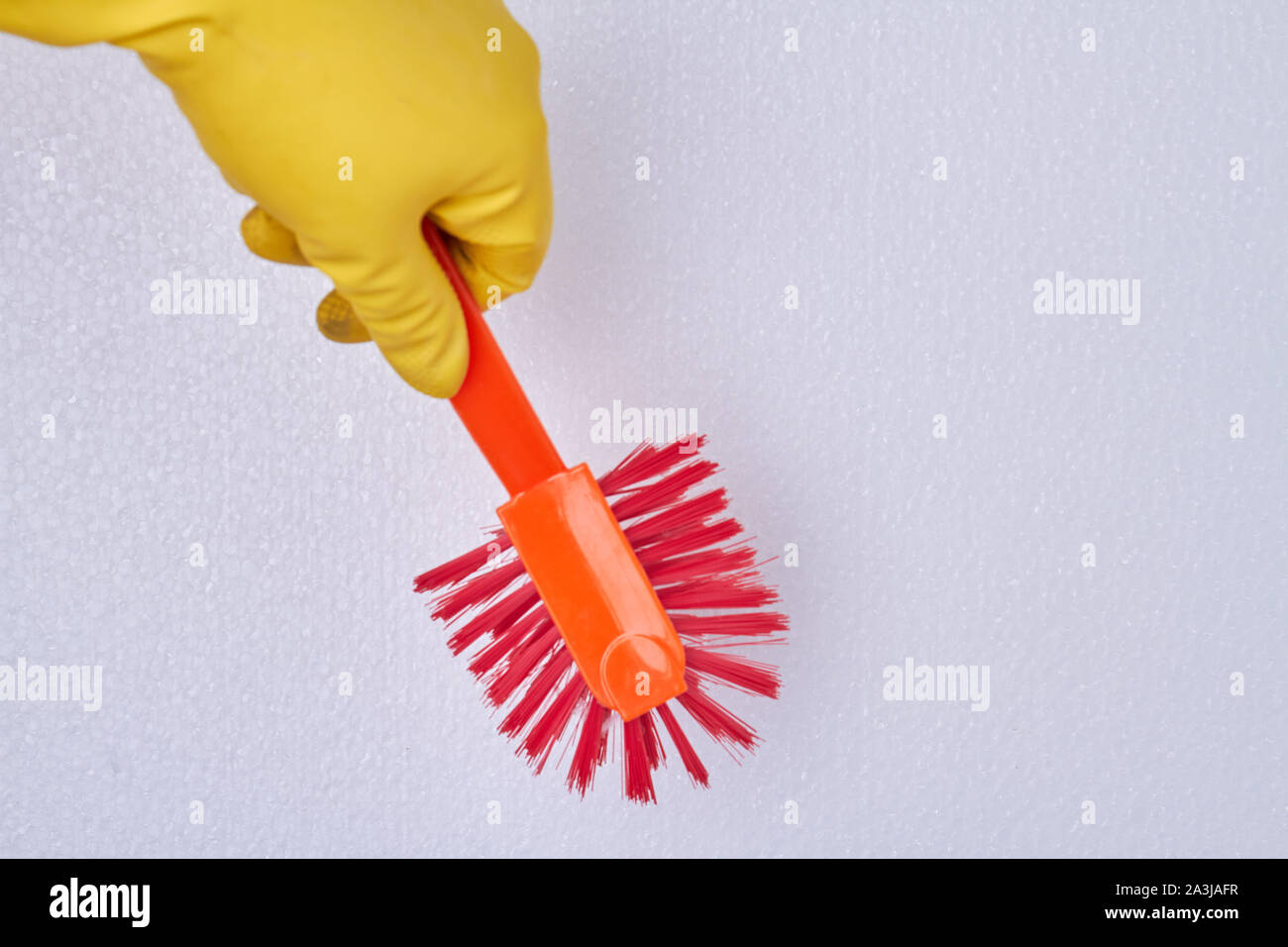 Human hand with tool for cleaning Stock Photo - Alamy