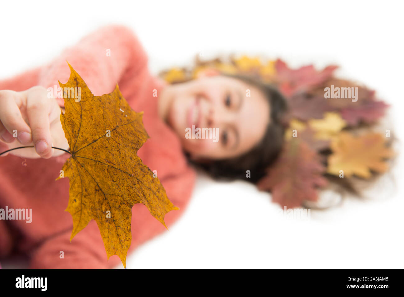 Take it. Child giving leaf close up. Girl cute kid long hair lay on ...