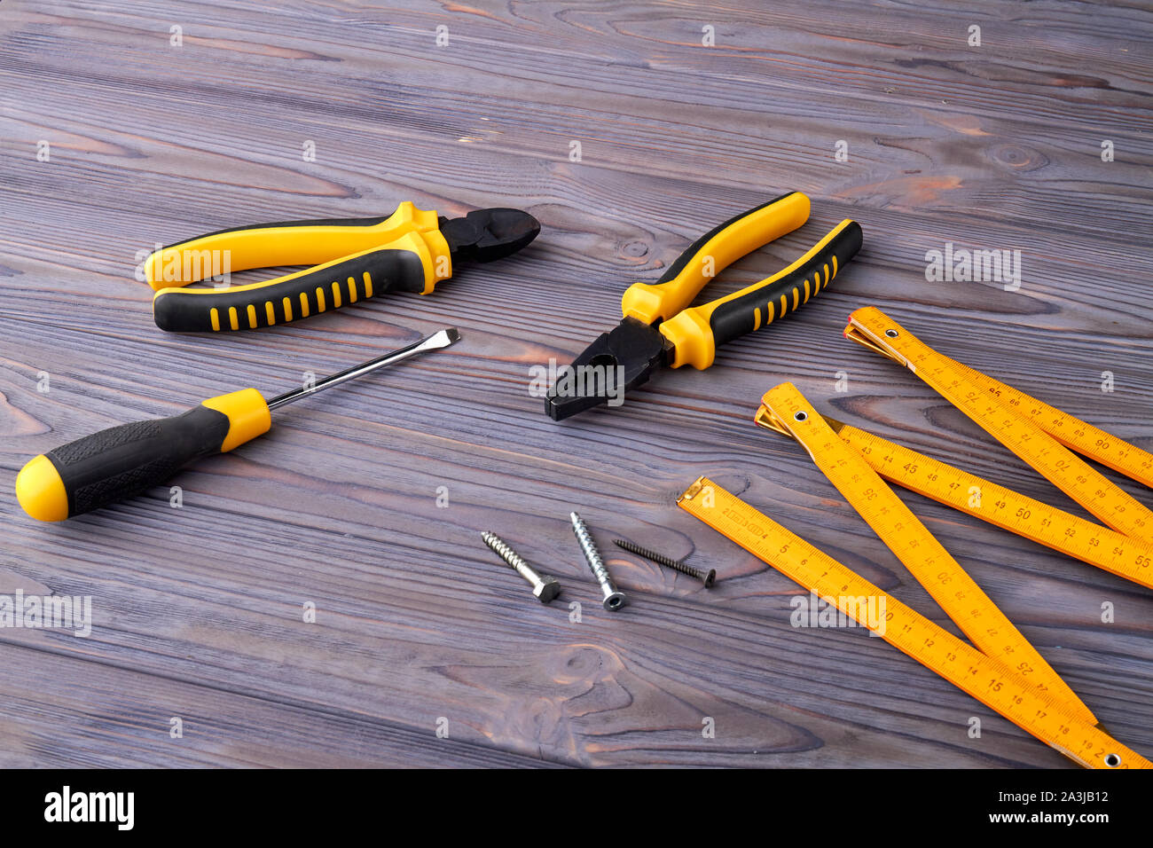 Set of assorted work tools at wood table Stock Photo - Alamy