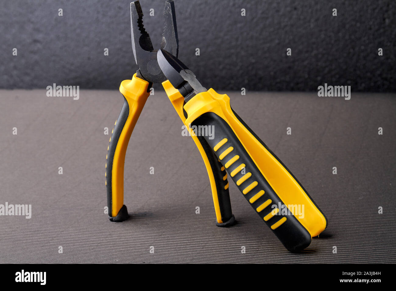Pliers with rubber handles Stock Photo - Alamy