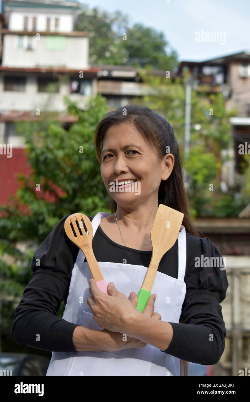 Old lady wearing apron hi-res stock photography and images - Alamy