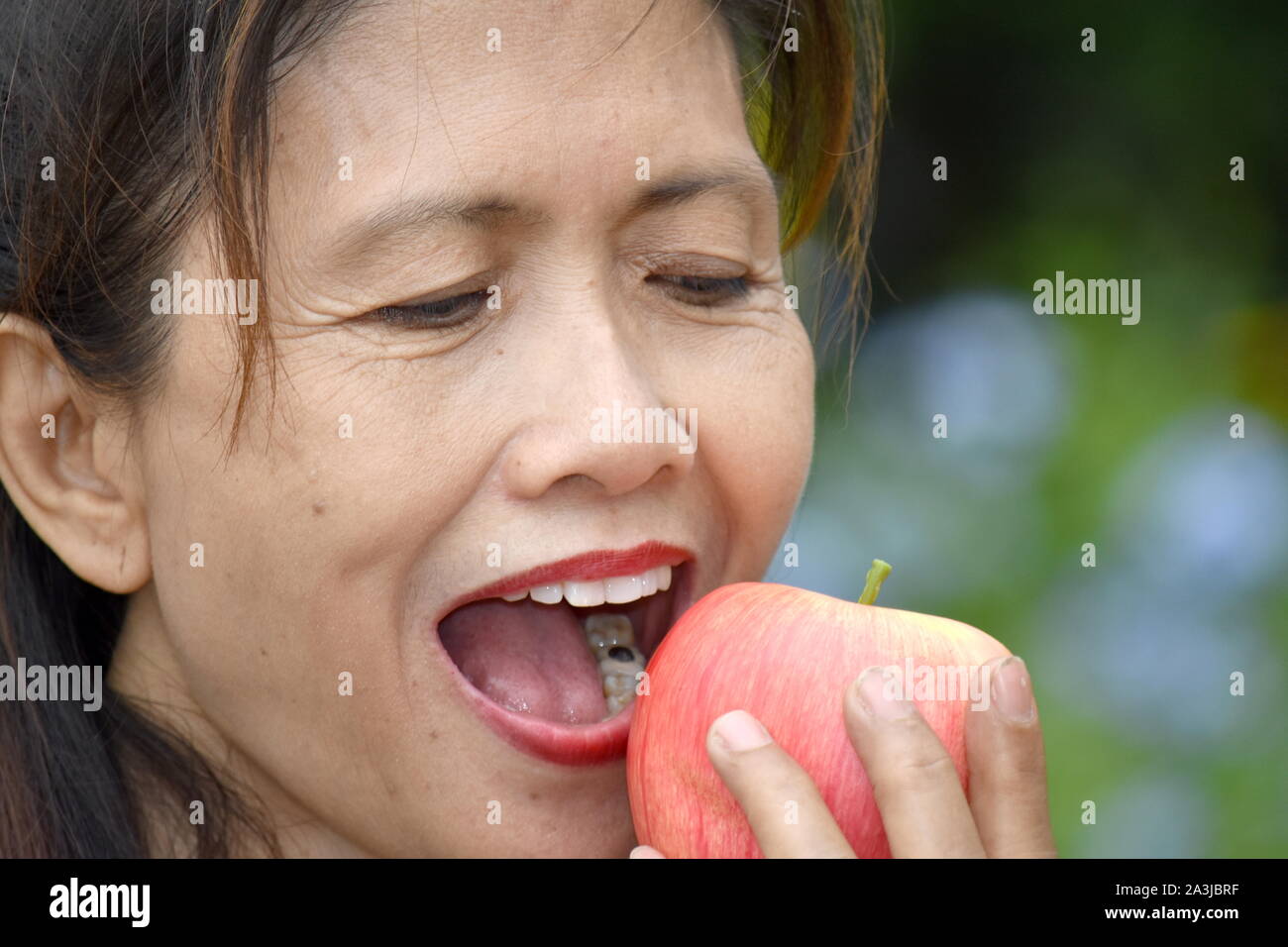 Female eating fruit hi-res stock photography and images - Alamy
