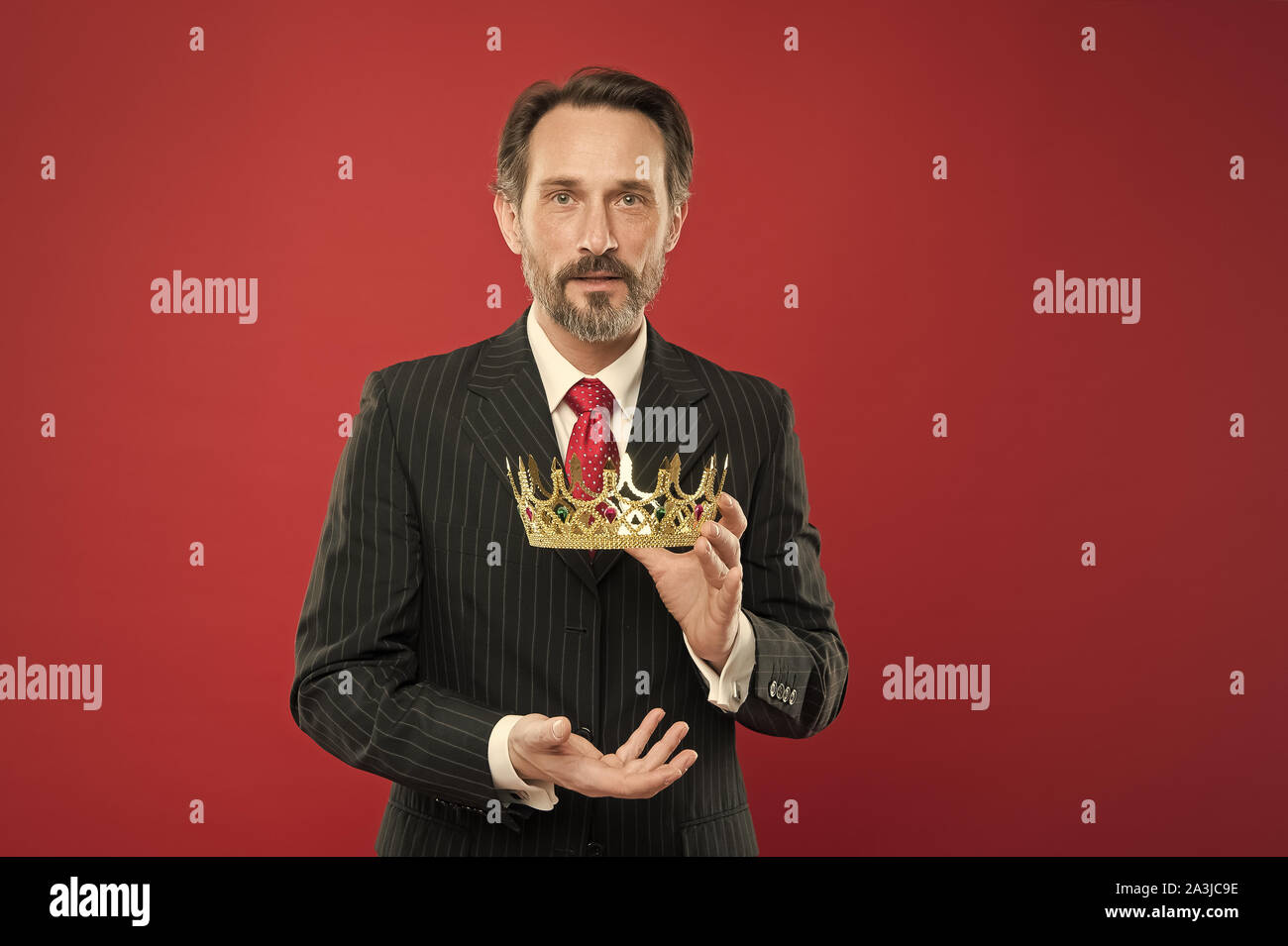 Reaching the height of luxury and elegance. Mature man holding luxury ...