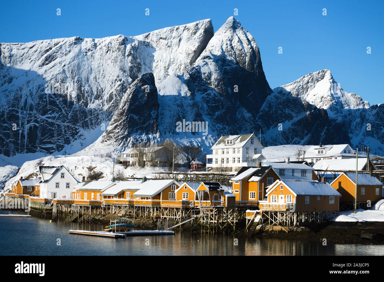 traditional norwegian wooden house rorbu to stand on the shore of the ...