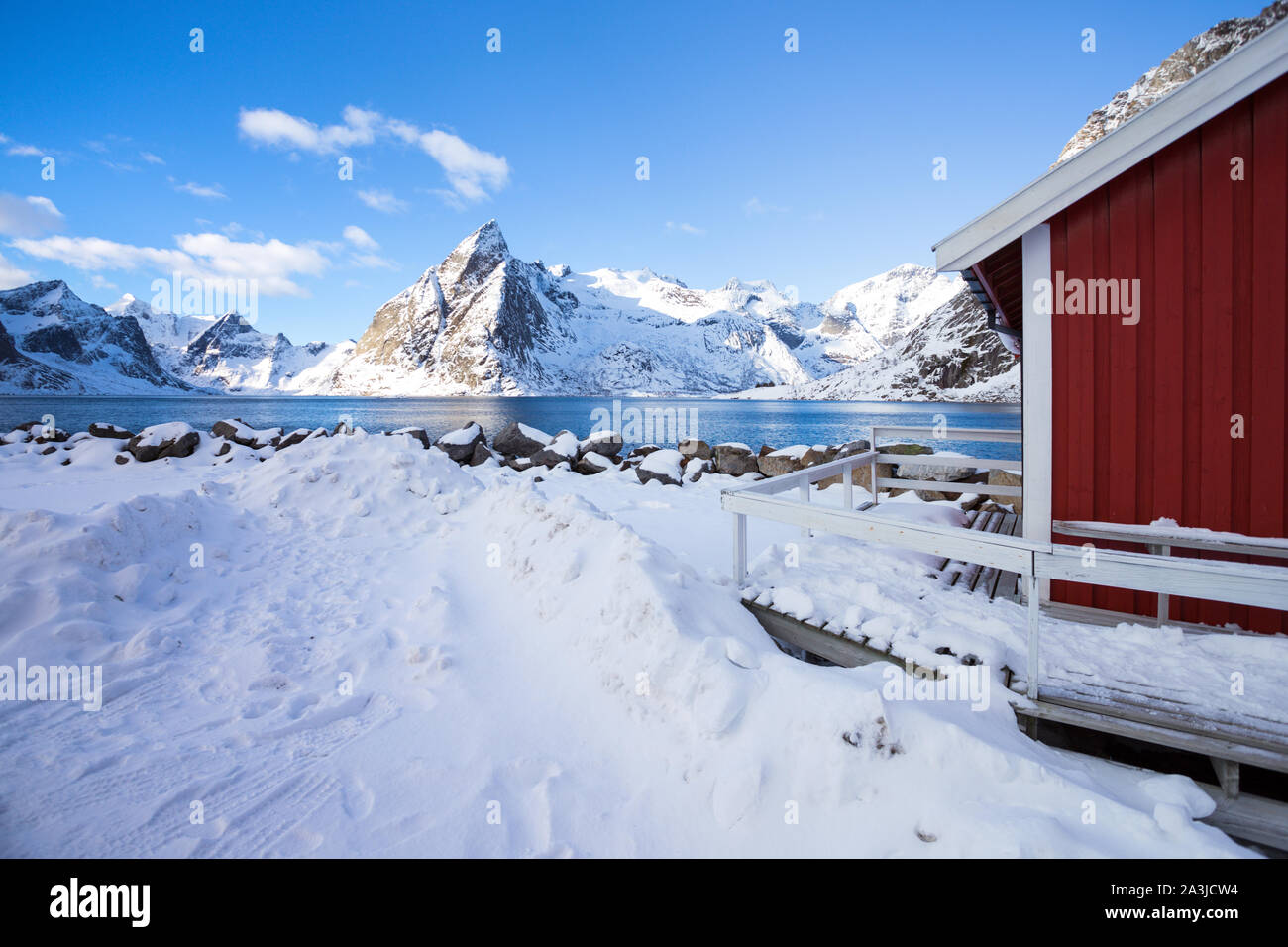 traditional norwegian wooden house rorbu to stand on the shore of the ...