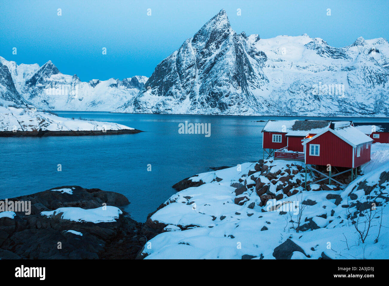 traditional norwegian wooden house rorbu to stand on the shore of the ...