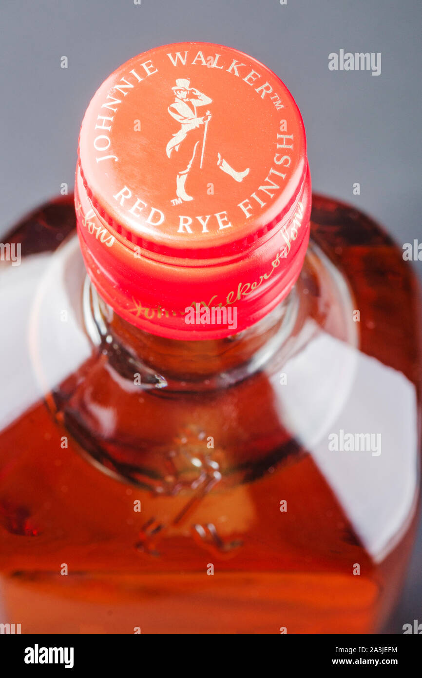 Johnnie Walker red rye finish blended whisky on stone slate background ...