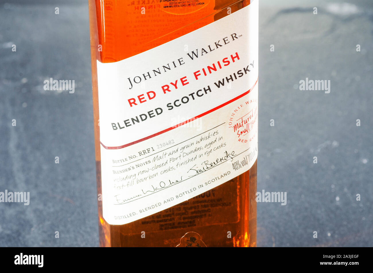 Johnnie Walker red rye finish blended whisky on stone slate background ...