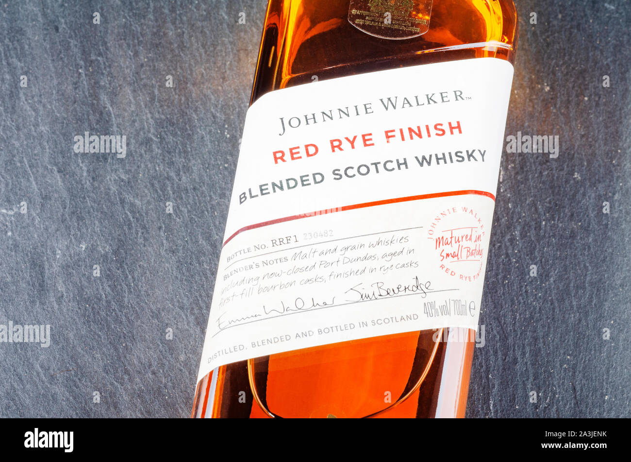Johnnie Walker red rye finish blended whisky on stone slate background ...