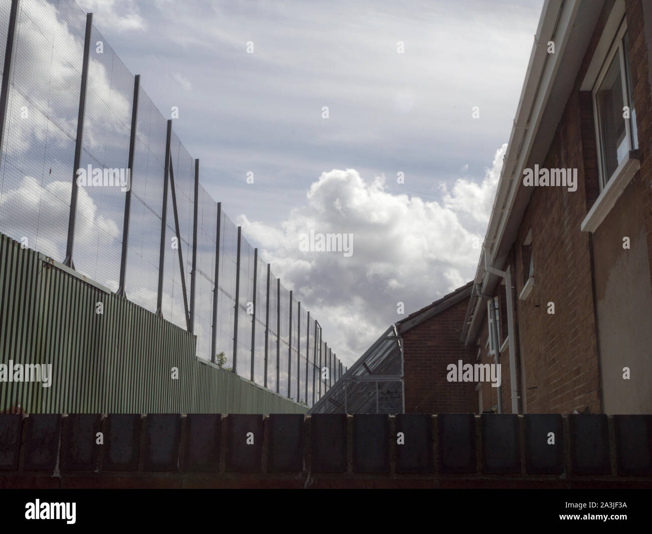The peace line at Bombay Street/Cupar Way in Belfast Stock Photo - Alamy