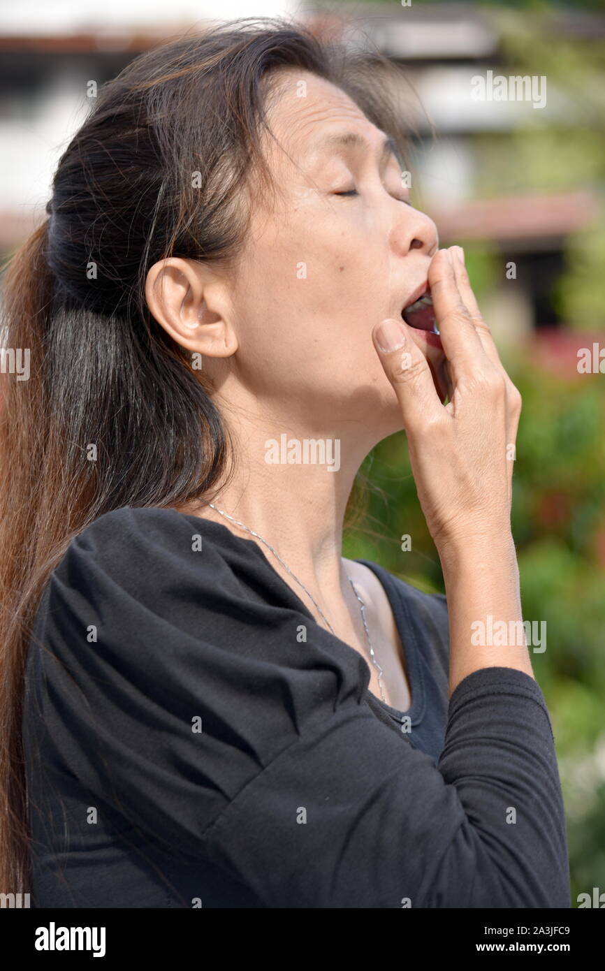 Yawning mature women hi-res stock photography and images - Alamy