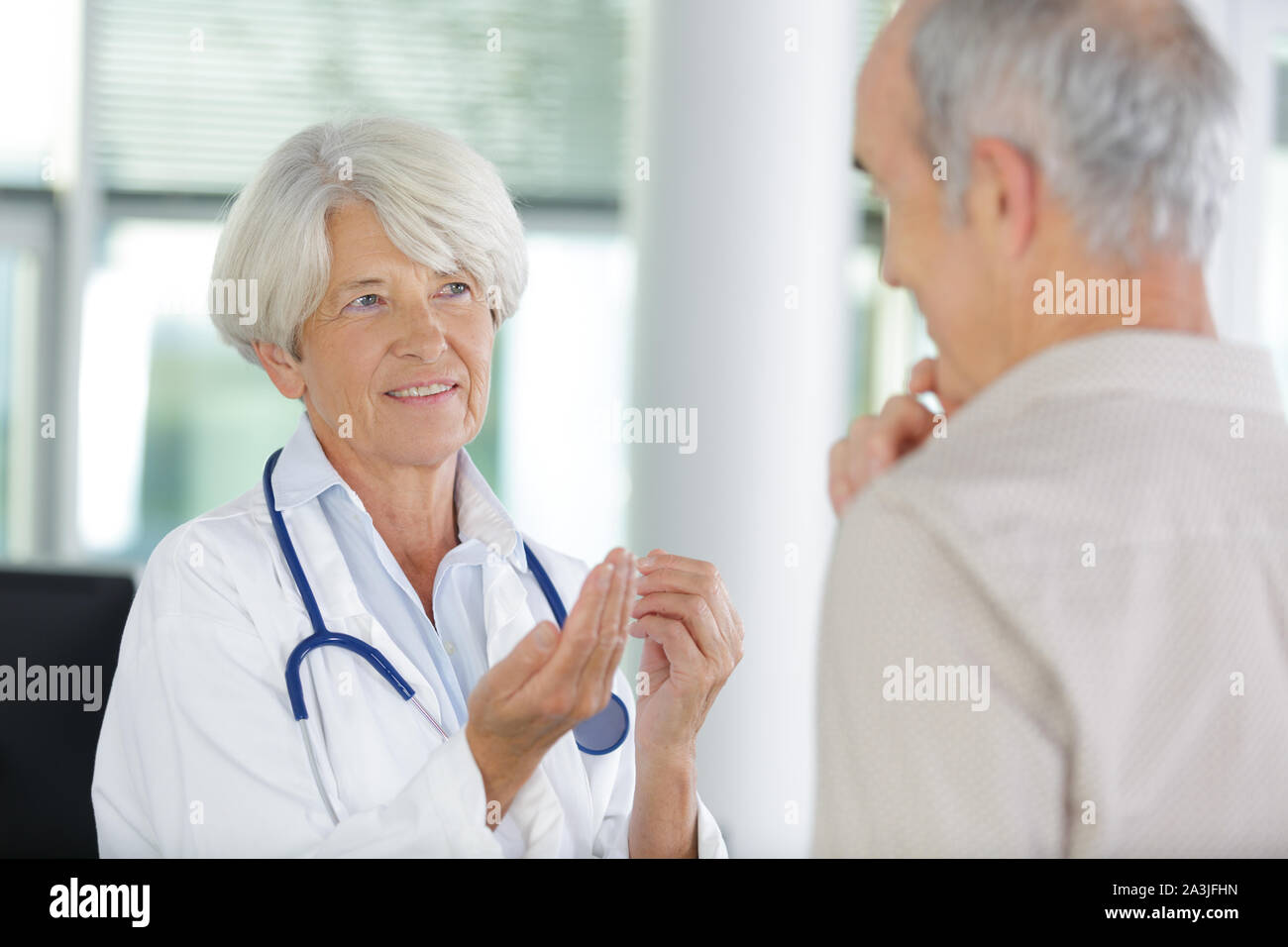 Clinician talking female patient hi-res stock photography and images ...