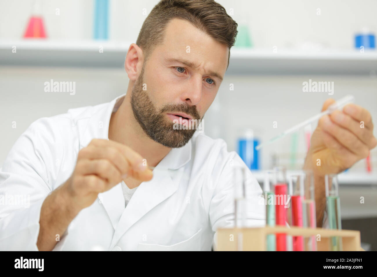 two scientists doing experiments with chemical liquid in the lab Stock ...