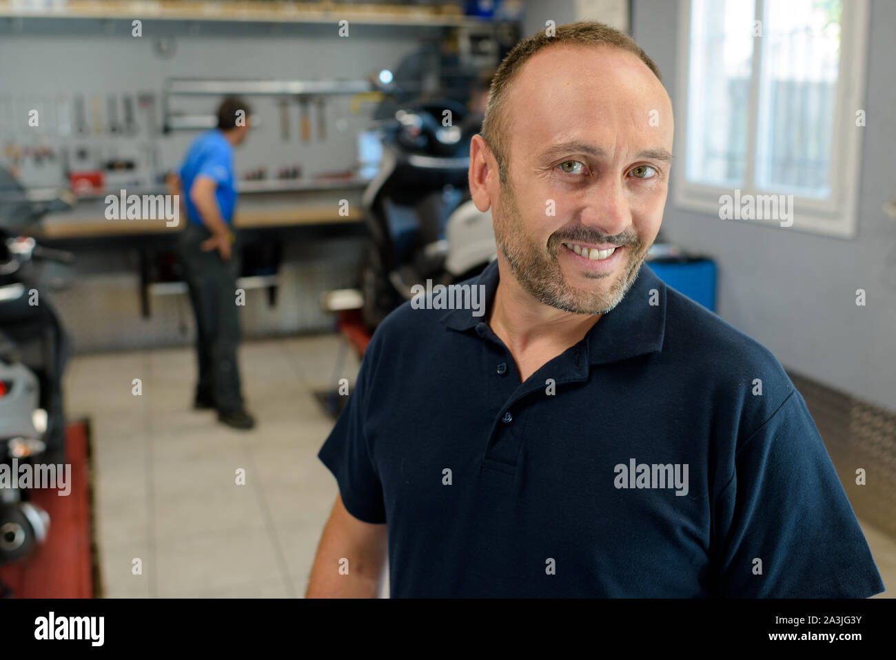 man in the workshop posing Stock Photo - Alamy