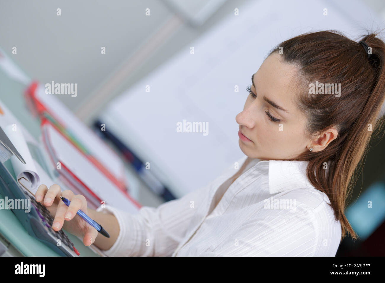 student with notebook and calculator Stock Photo - Alamy