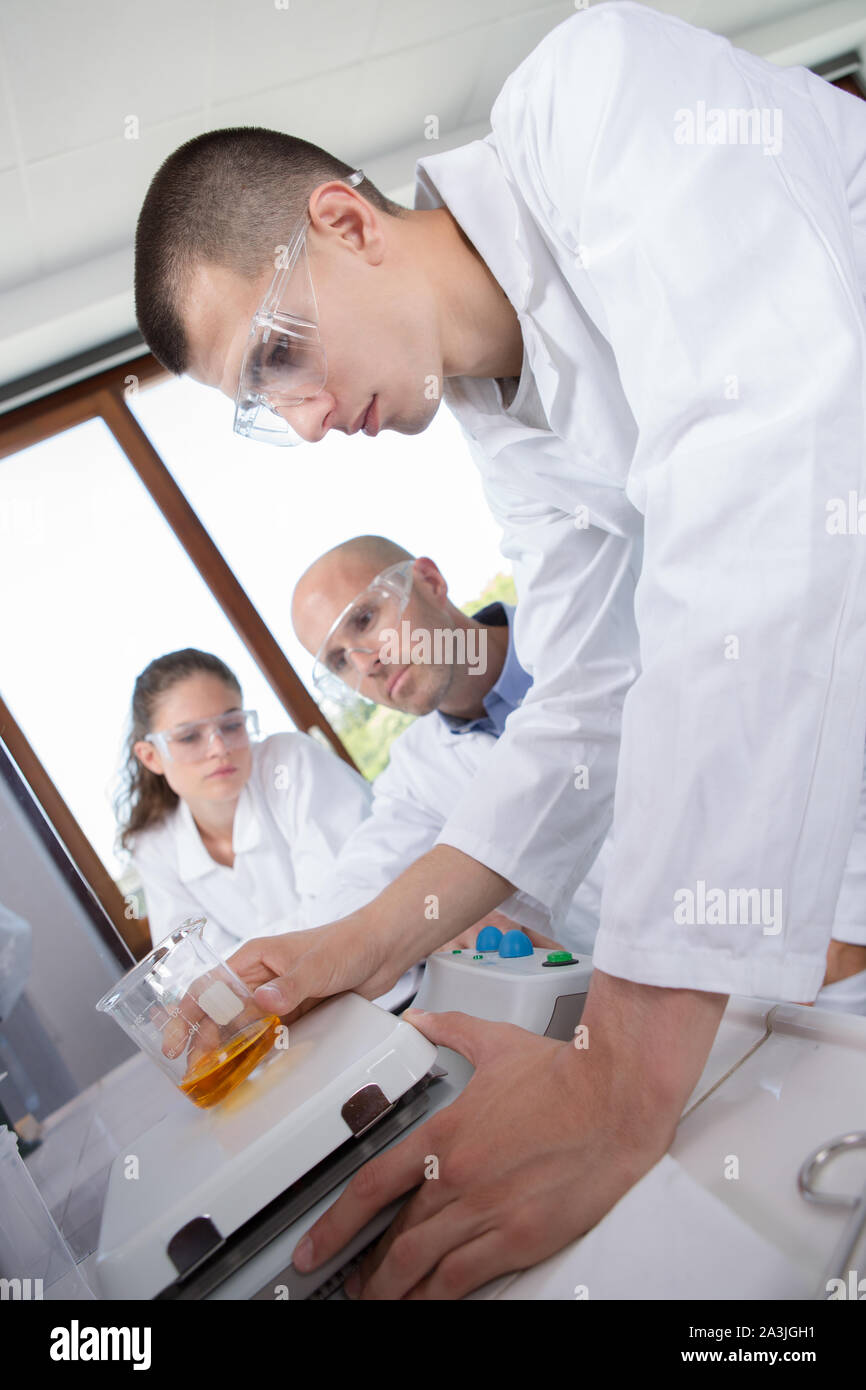 observing results of chemistry experiment Stock Photo - Alamy