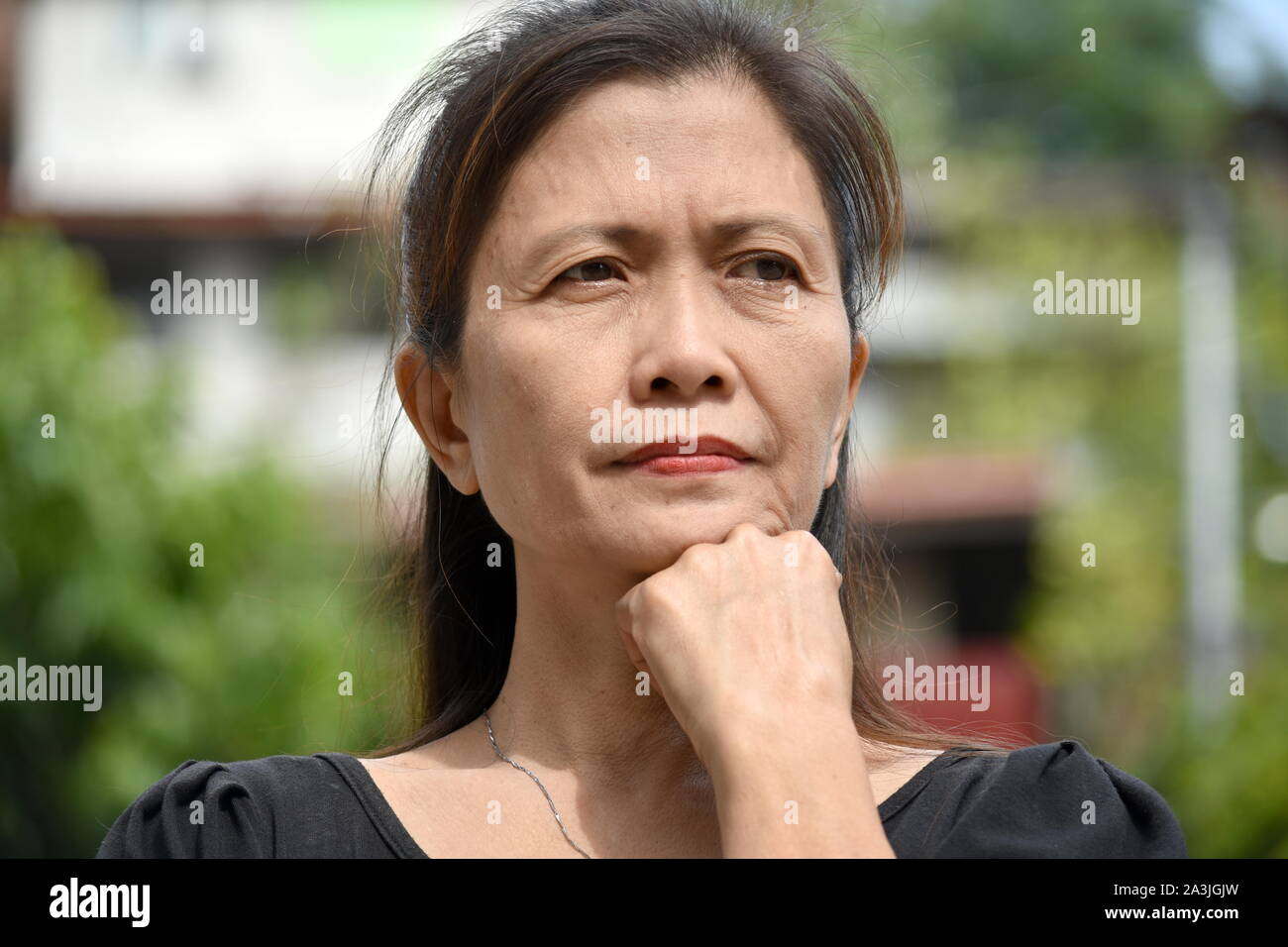 A Female Senior Making A Decision Stock Photo - Alamy
