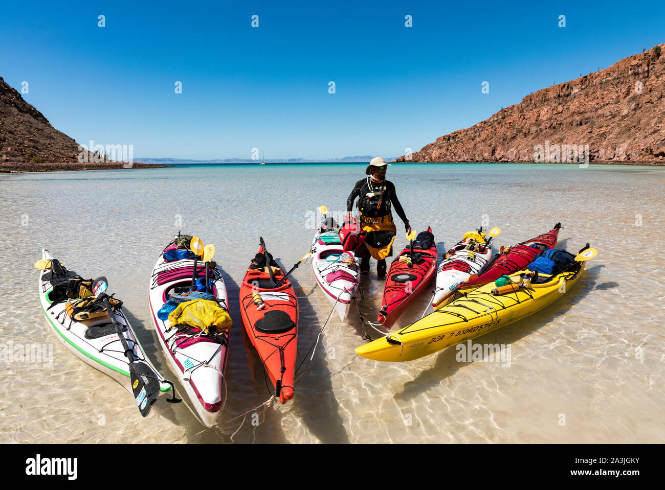 A Kayak guide unloads gear in a bay off Isla Espíritu Santo in the Gulf ...