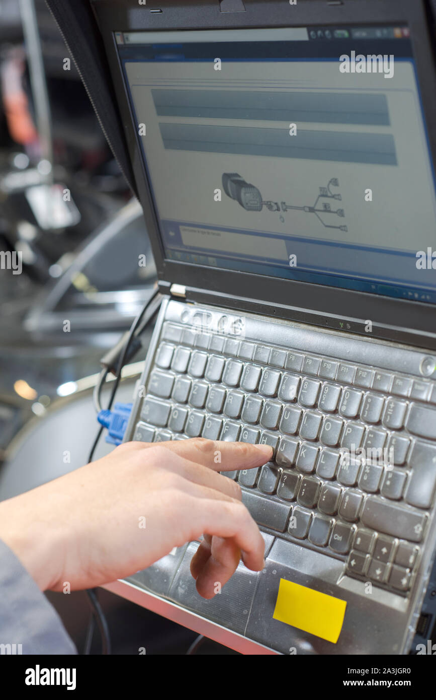 using laptop for vehicle diagnostic Stock Photo - Alamy