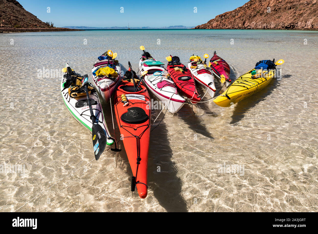Kayaks float in a bay off Isla Espíritu Santo in the Gulf of California ...