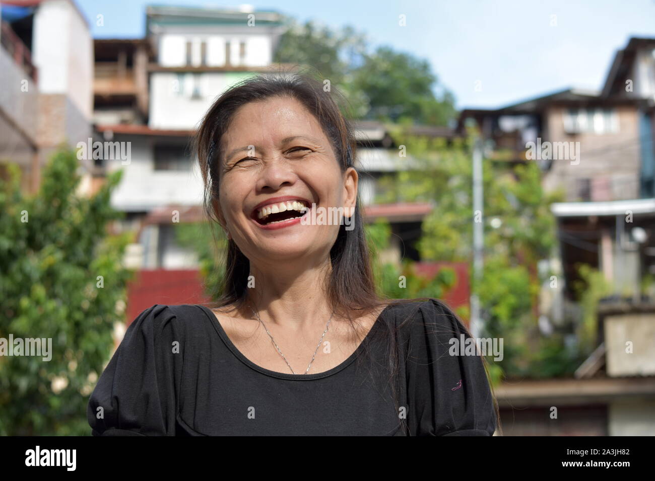 A Woman And Laughter Stock Photo - Alamy