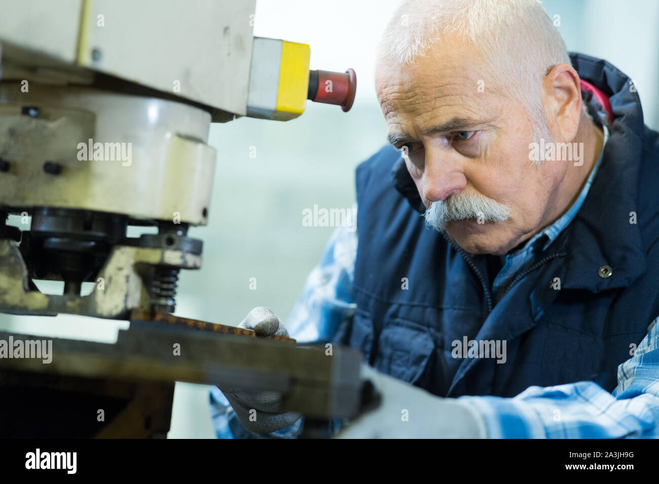 senior milling-machine operator works at machine Stock Photo - Alamy
