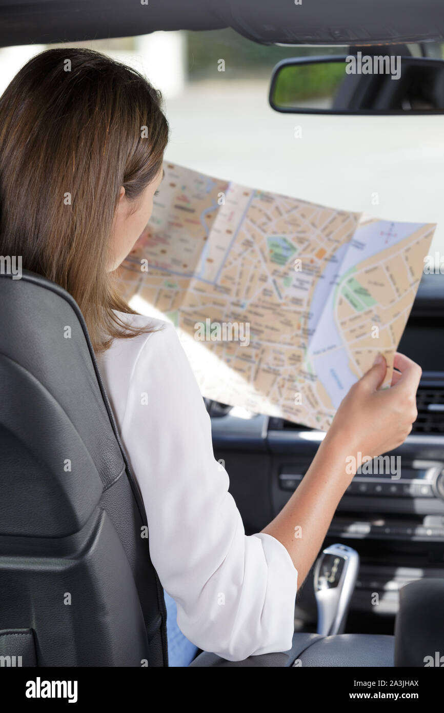 woman reading a map in a car Stock Photo - Alamy