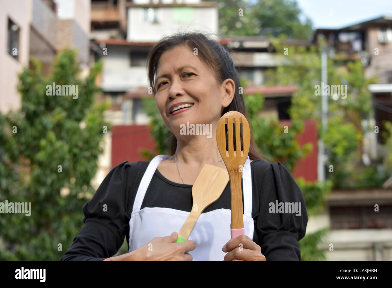 Old lady wearing apron hi-res stock photography and images - Alamy