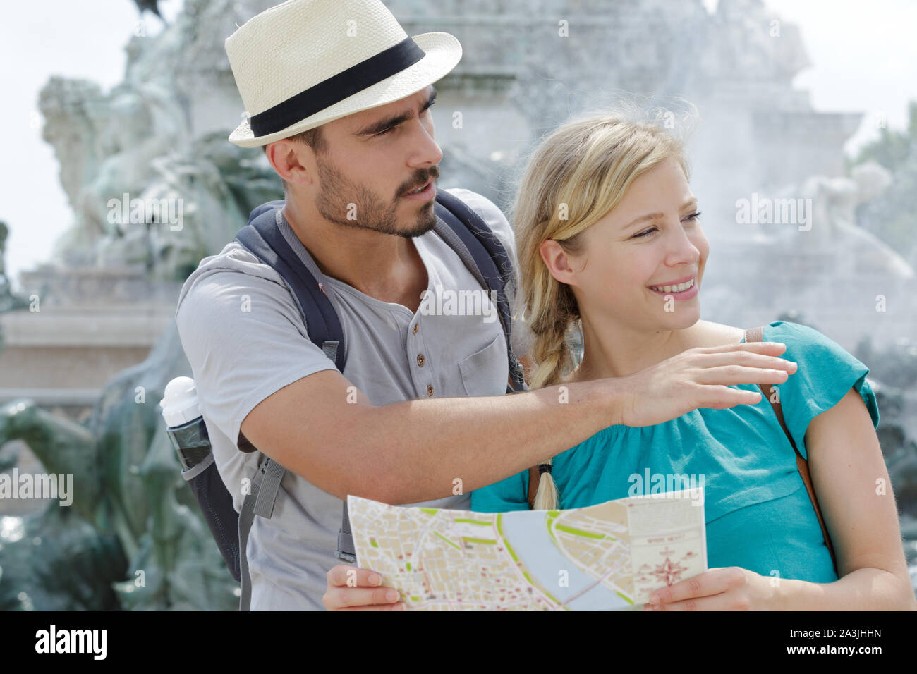 man and woman tourists with map Stock Photo - Alamy