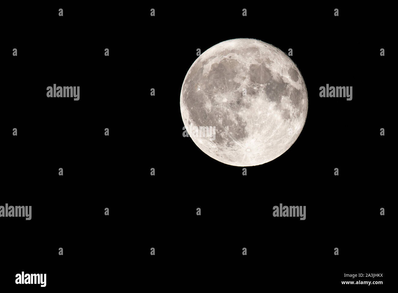 Full moon over black night sky for background use Stock Photo - Alamy