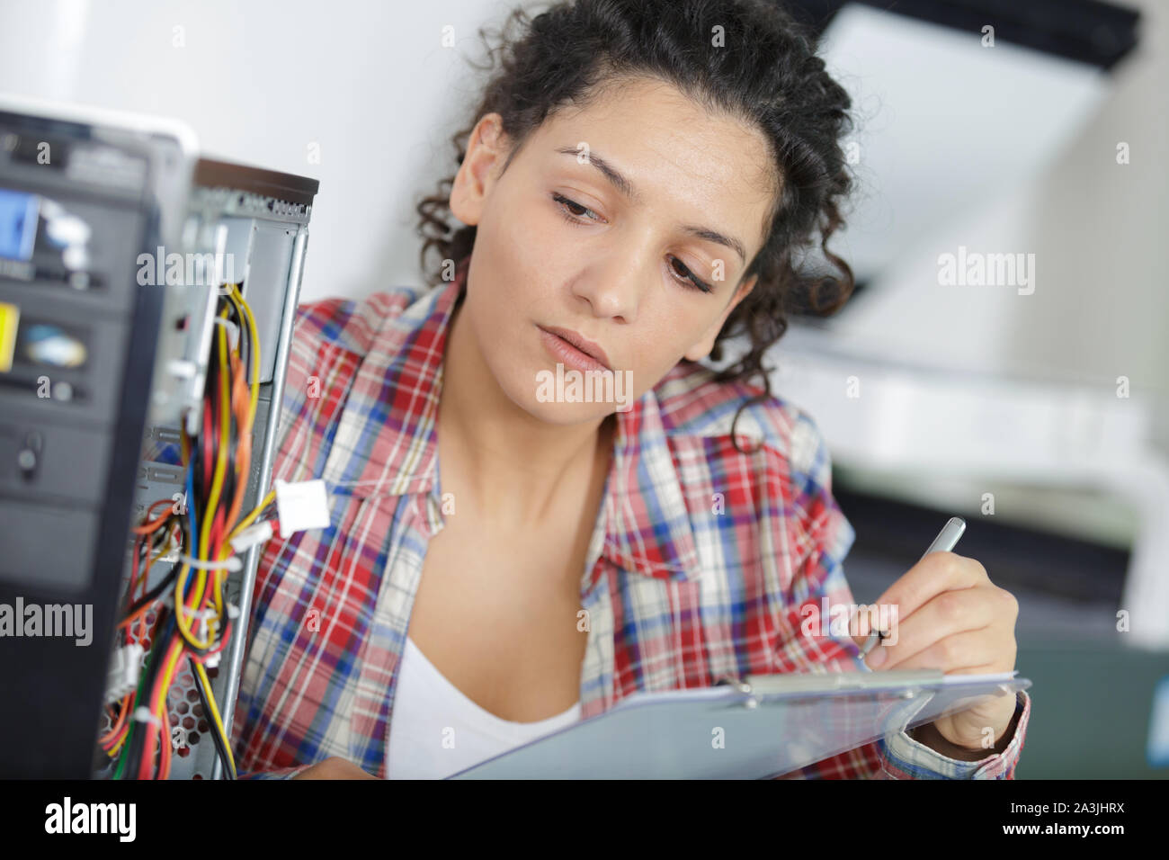 female pc technician fixing a pc Stock Photo - Alamy