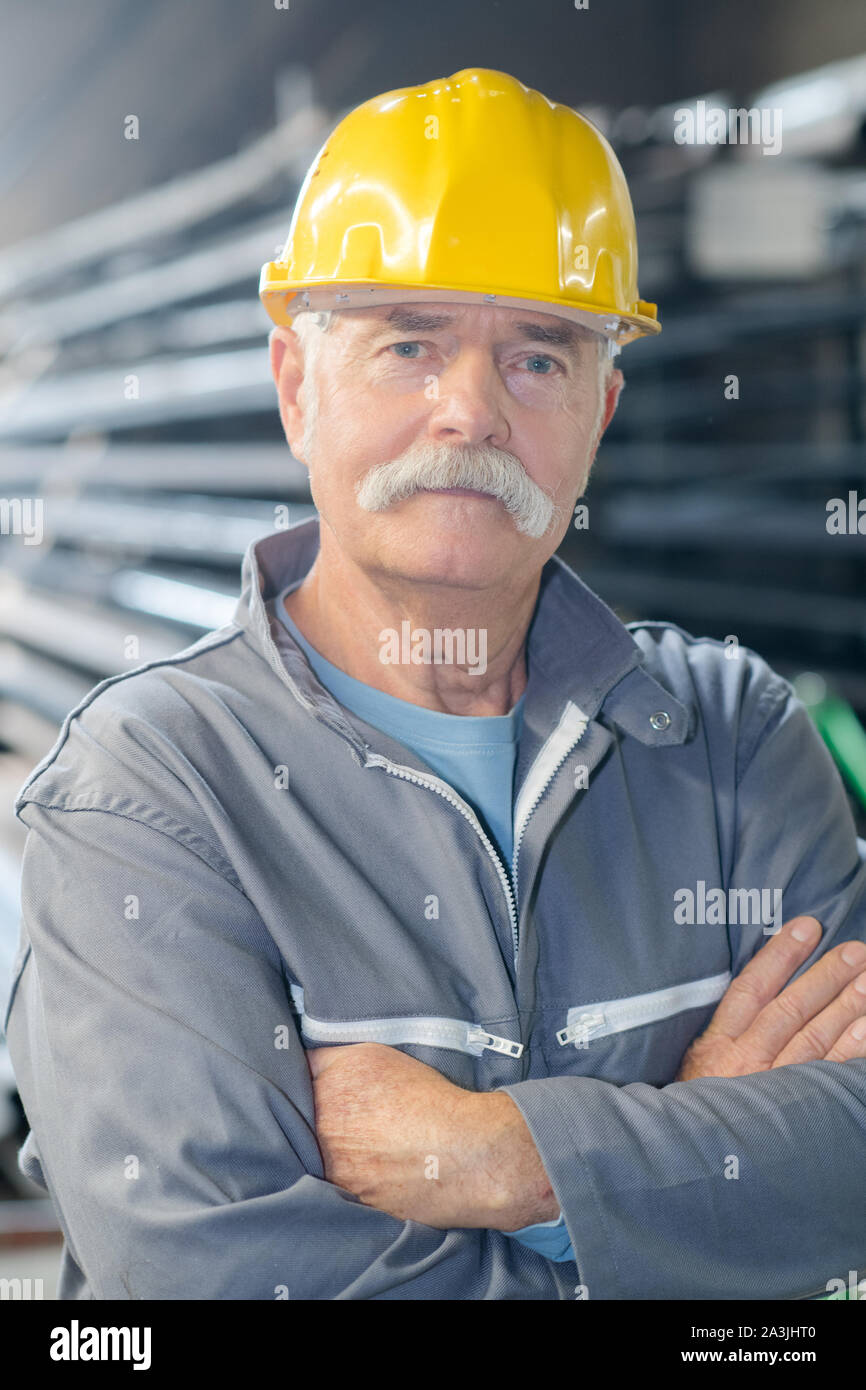 senior worker in a storage room in a factory Stock Photo - Alamy