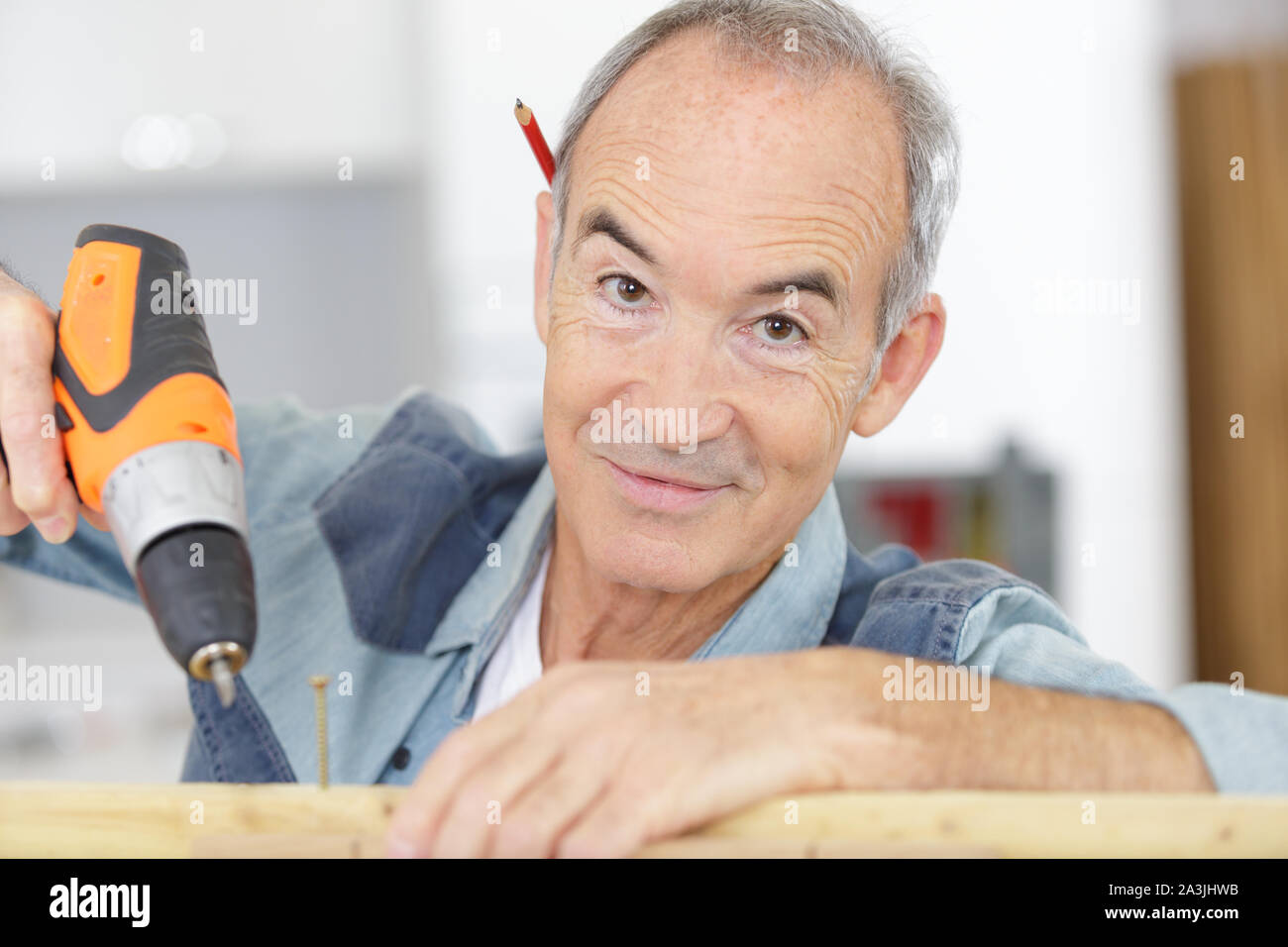 Man using old drill hi-res stock photography and images - Alamy