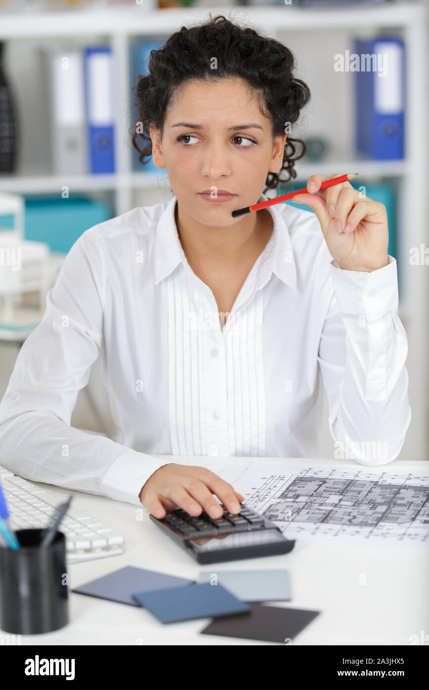 woman thinking in the office Stock Photo - Alamy