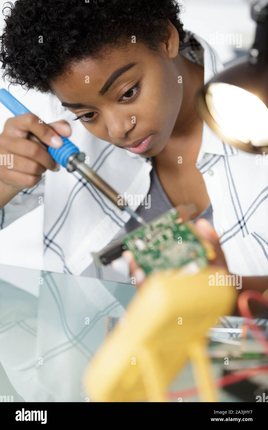 cute female engineer at home working on technology Stock Photo - Alamy
