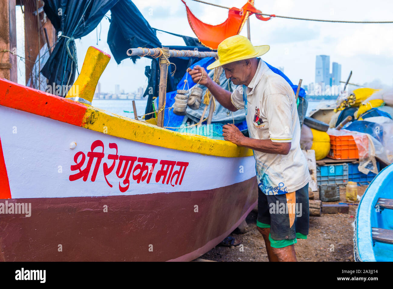 Indian man working in a fishermen village near Mumbai India Stock Photo ...