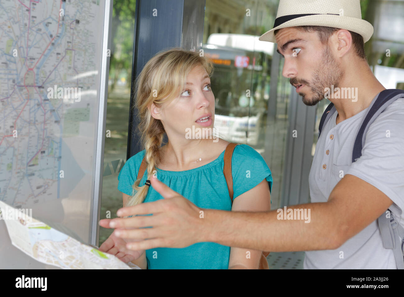 angry couple of tourists discussing about the map Stock Photo - Alamy