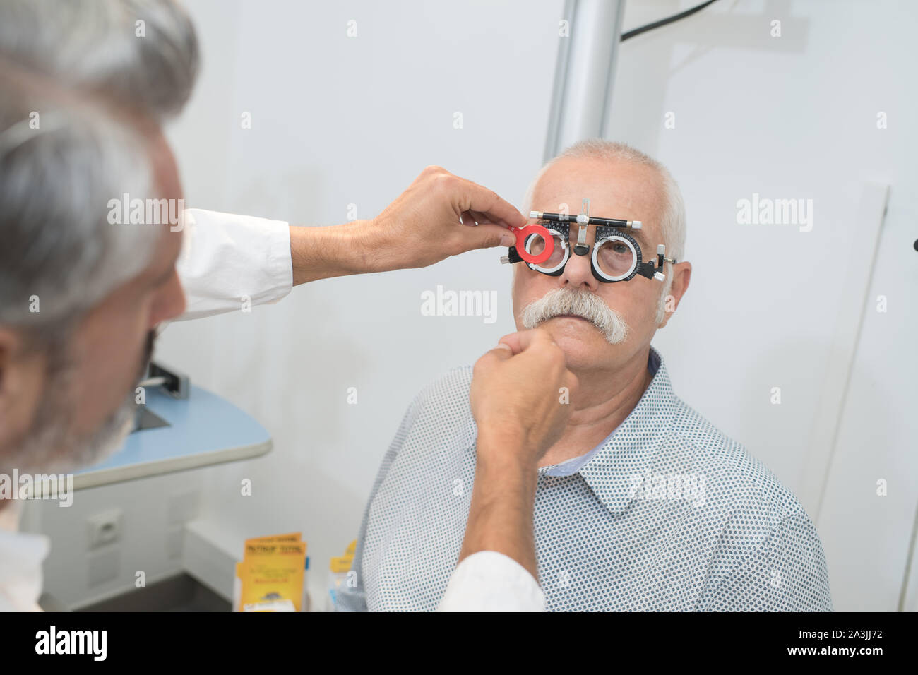 Old man eye test hi-res stock photography and images - Alamy