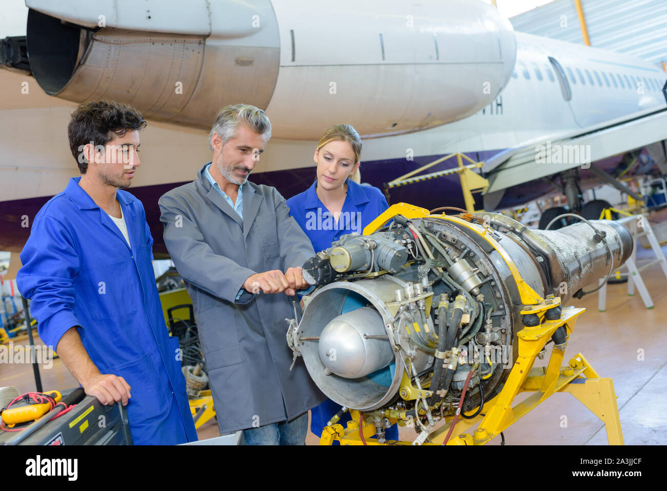 aviation technician studying a part Stock Photo - Alamy