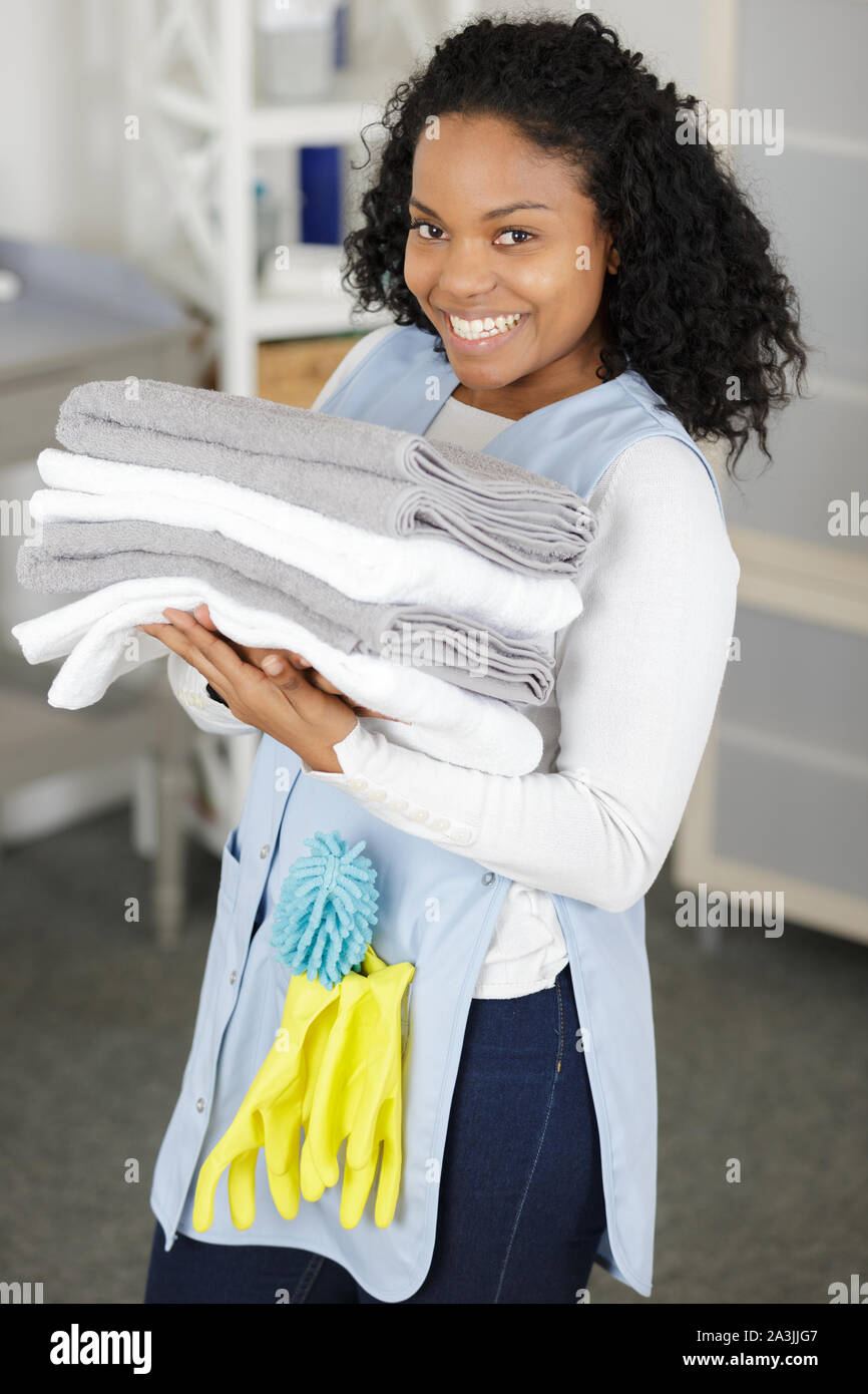 maid with of laundry basket Stock Photo - Alamy