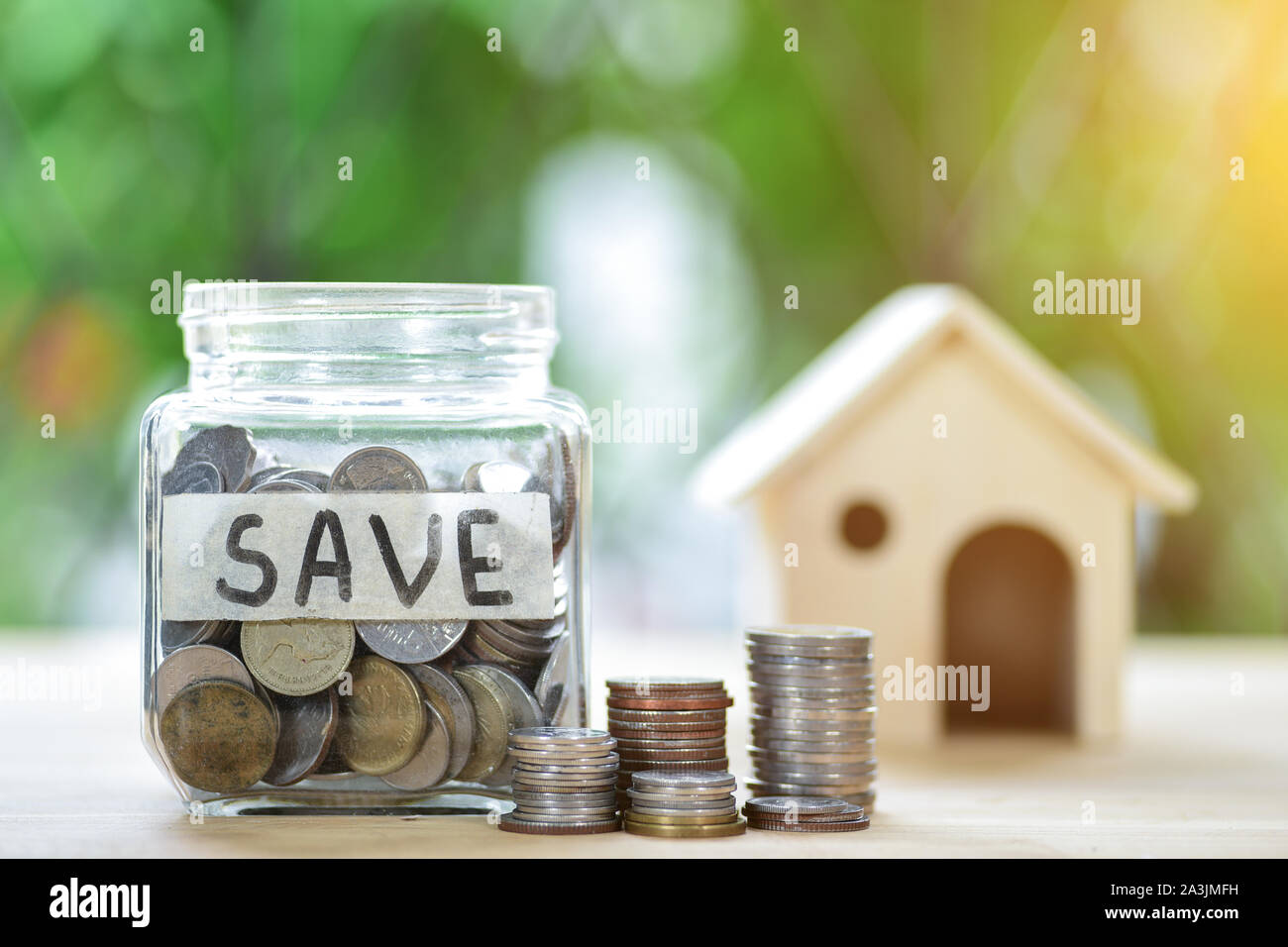 Mortgage concept. Money and house Stock Photo - Alamy