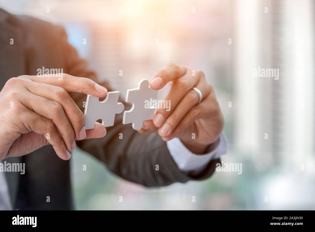 Hand jigsaw puzzle hi-res stock photography and images - Alamy