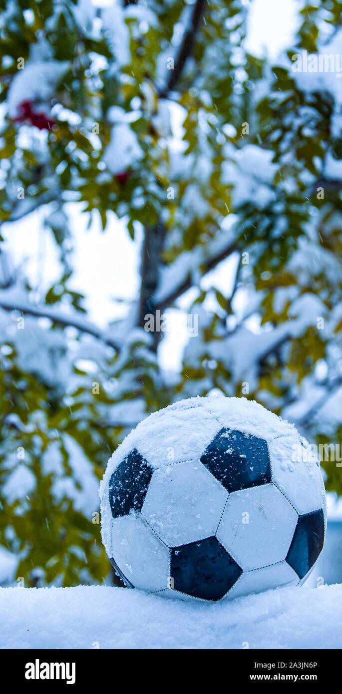 Soccer Ball, football with snow during winter Stock Photo - Alamy