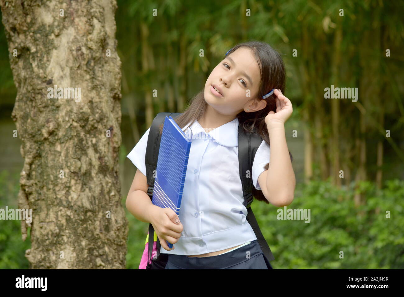 A Posing Female Student Stock Photo - Alamy